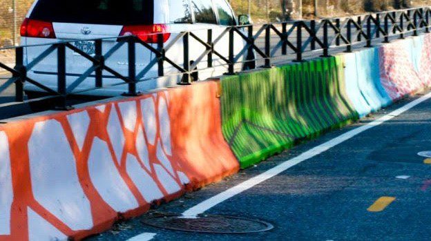 Painting barriers and bin blocks can brighten them up.