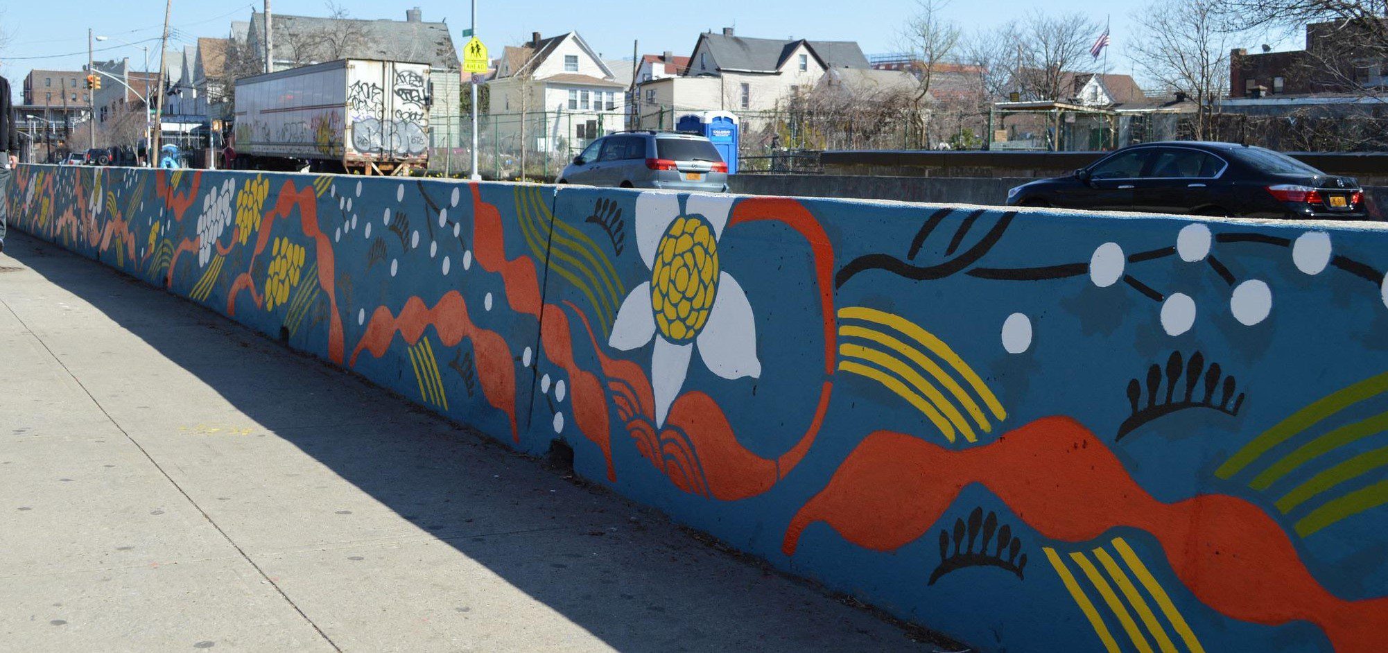 Painting barriers and bin blocks can brighten them up.